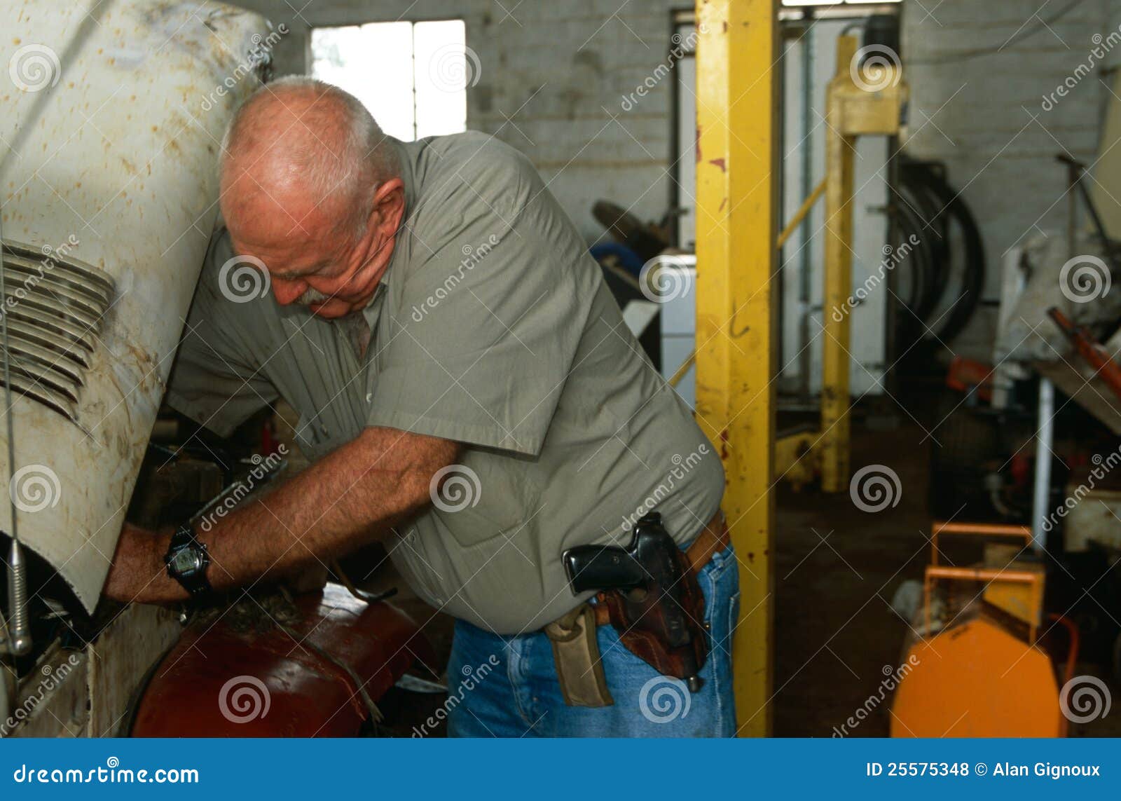 An Armed Man Working in a Garage, South Africa Editorial Stock Photo ...