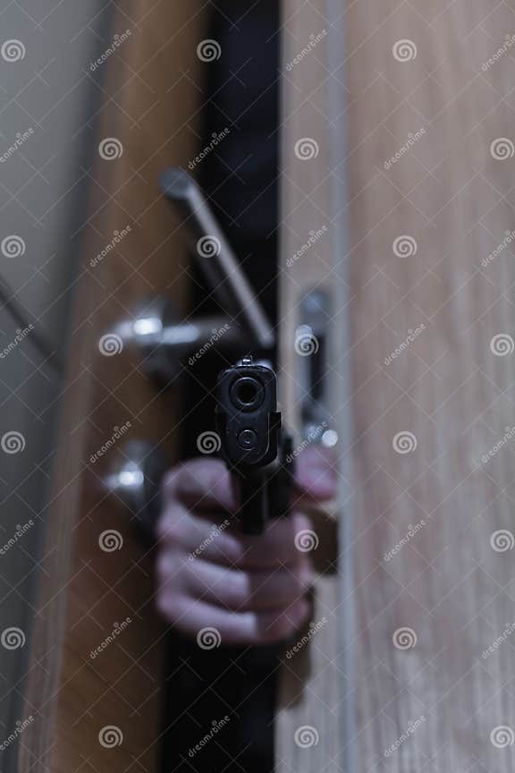 Armed robber pointing gun stock image. Image of robbery - 65244877