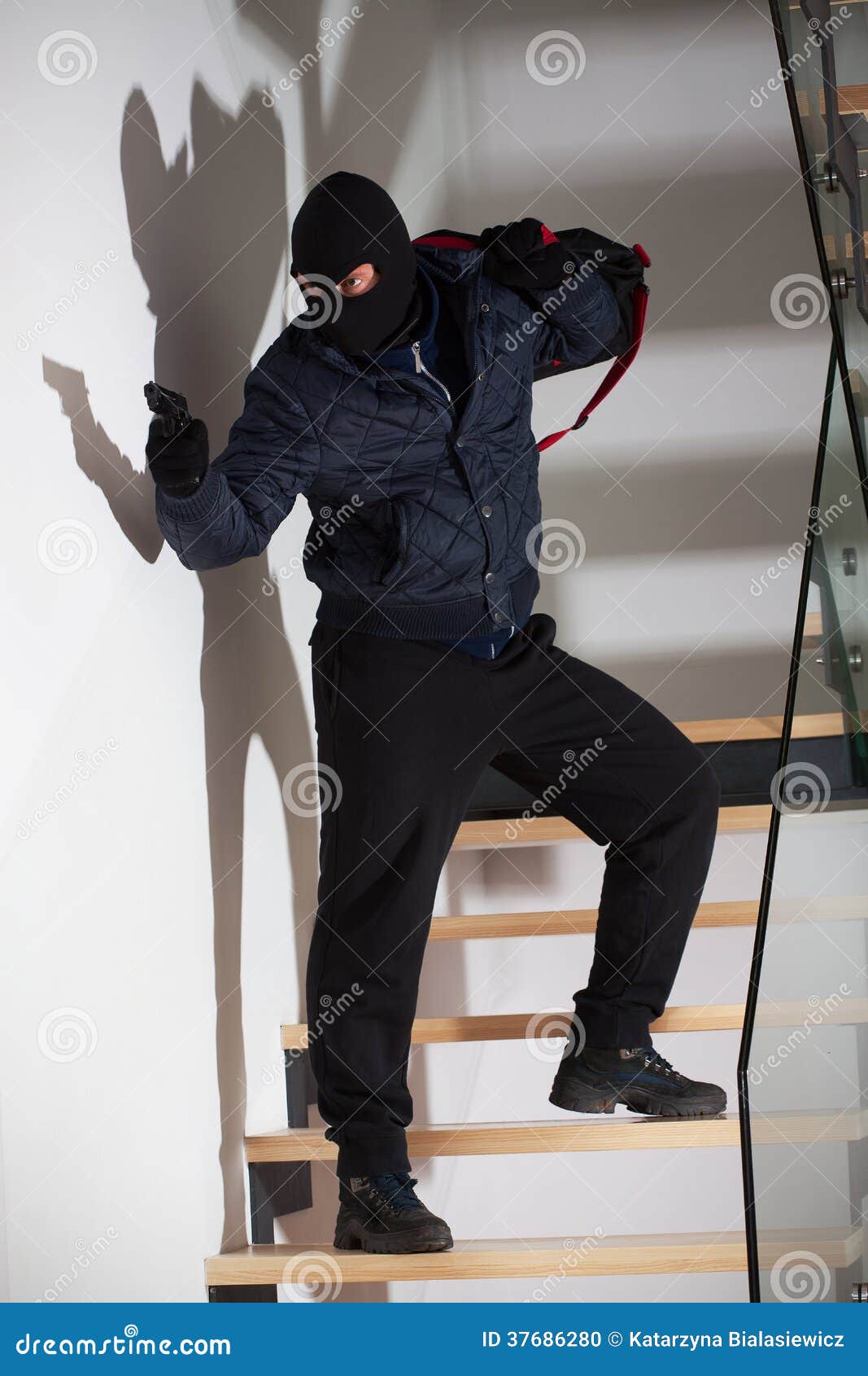 Armed robber on stairs stock photo. Image of house, criminal - 37686280