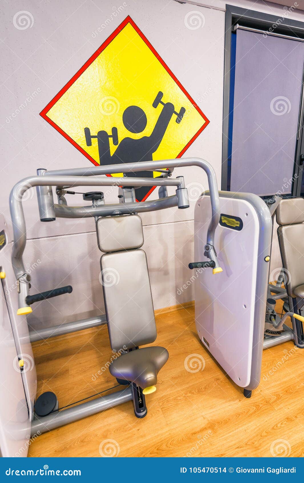 Arms machine in gym room stock photo. Image of activity - 105470514