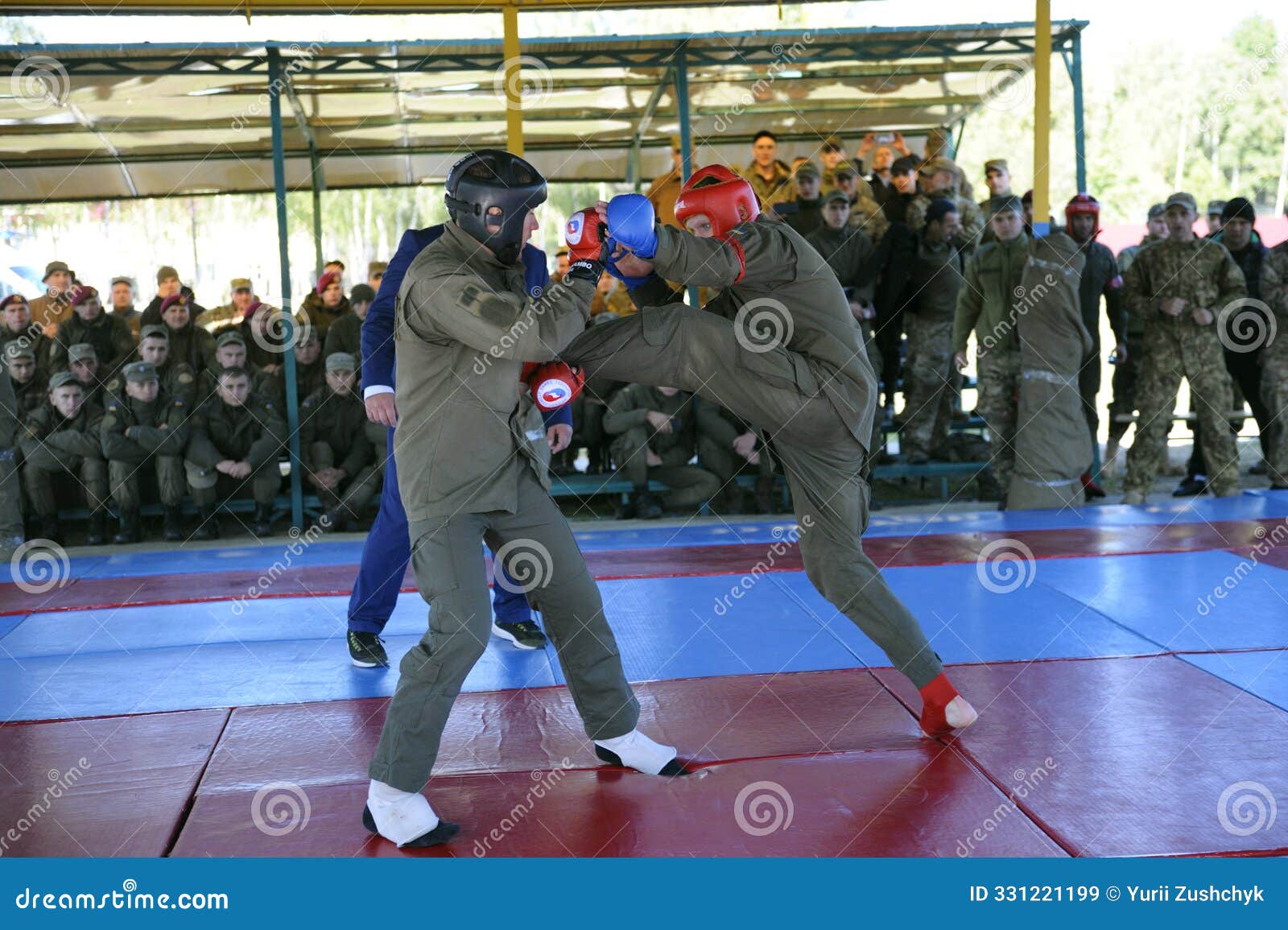 Army Combative. Two Fighters Fighting in a Ring, Referee Watching ...