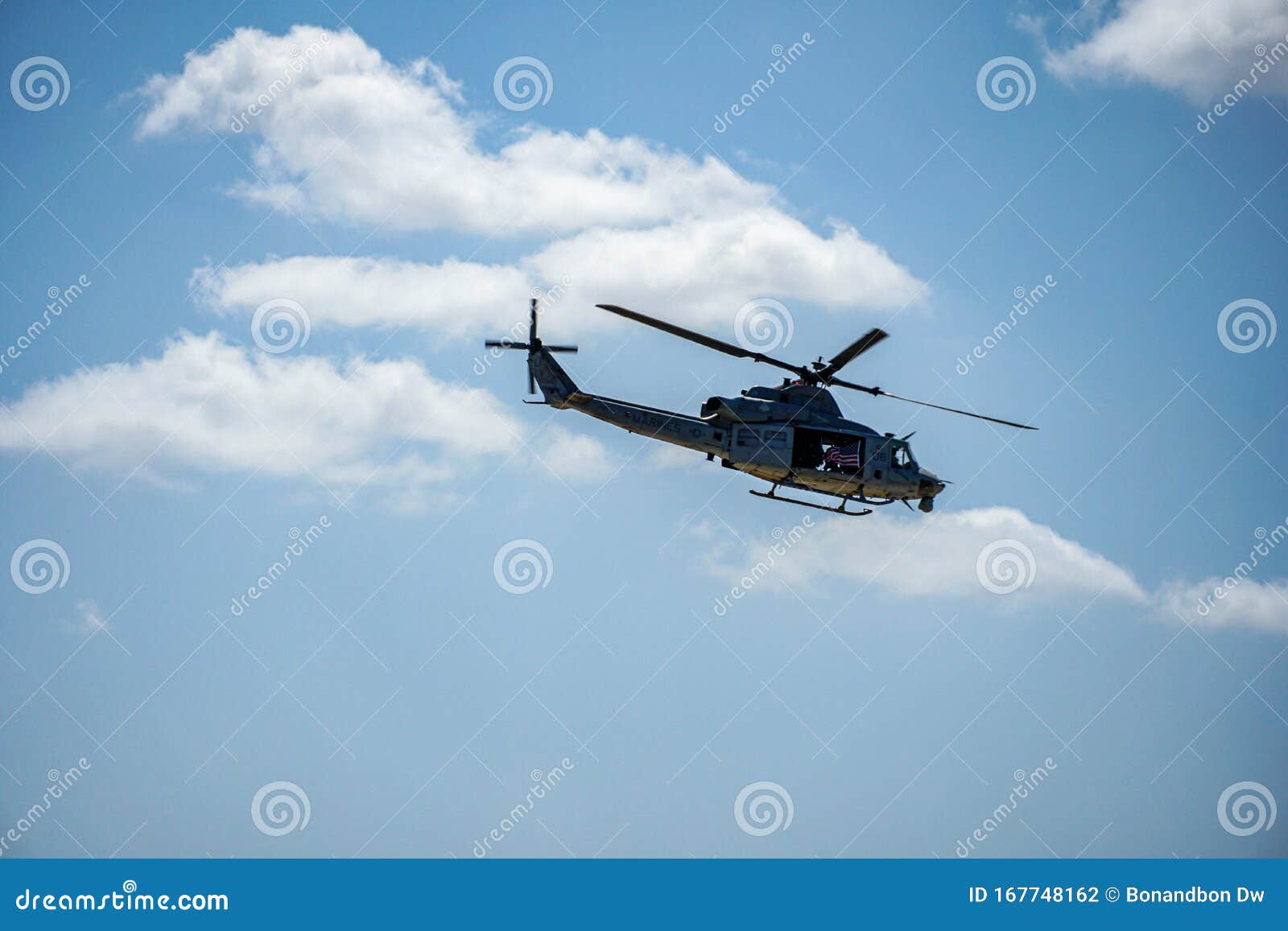 Army Helicopter Hovering on a Blue Sky Background. Editorial ...