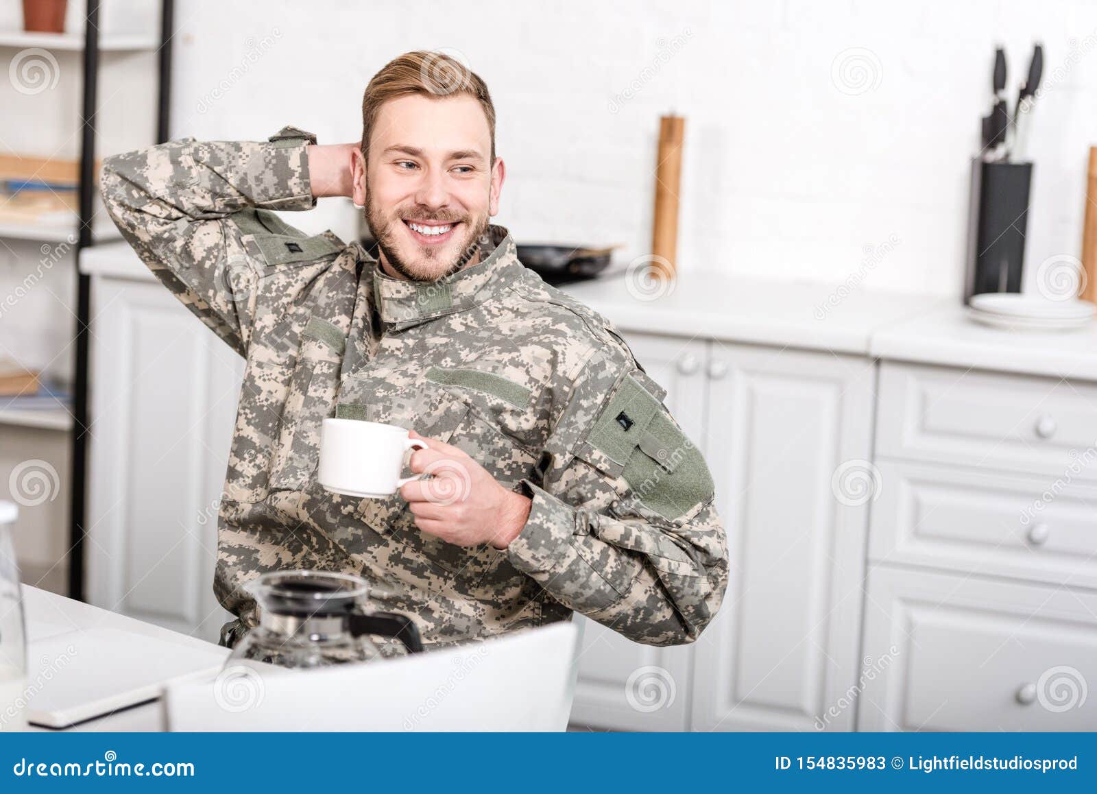 Army Soldier Sitting at Kitchen Table with Cup Stock Image - Image of ...