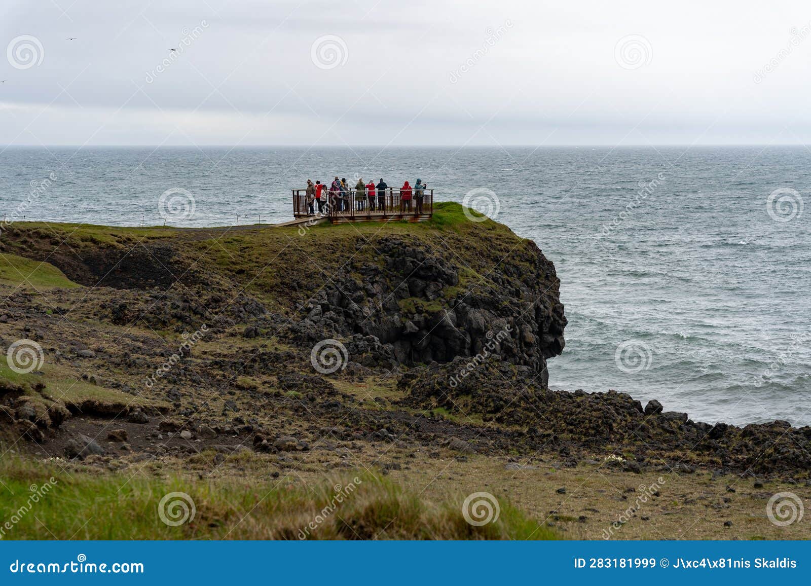 Tourists on Viewpoint at Black Basalt Cliffs at Arnarstapi Cliffs in ...