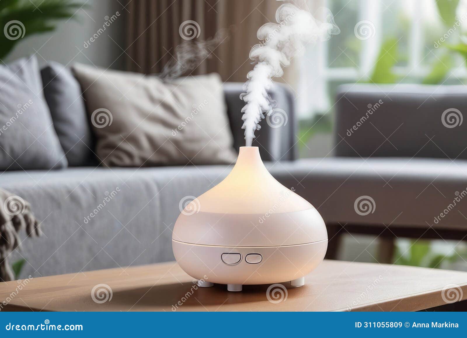 Aroma Oil Diffuser with Rising Steam Flow on Table in Living Room ...