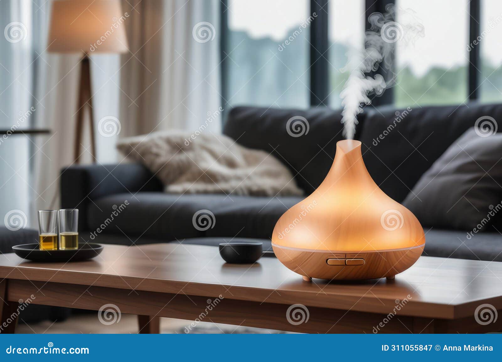 Aroma Oil Diffuser with Rising Steam Flow on Table in Living Room ...