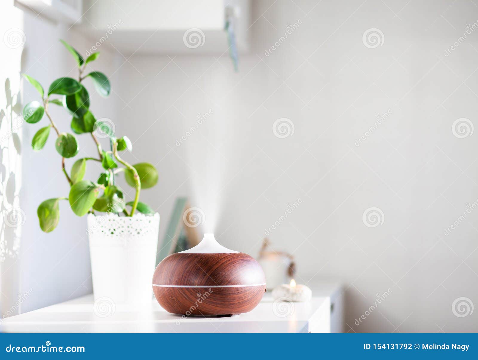 Aroma Oil Diffuser on Table at Home. Air Freshener Stock Photo - Image ...