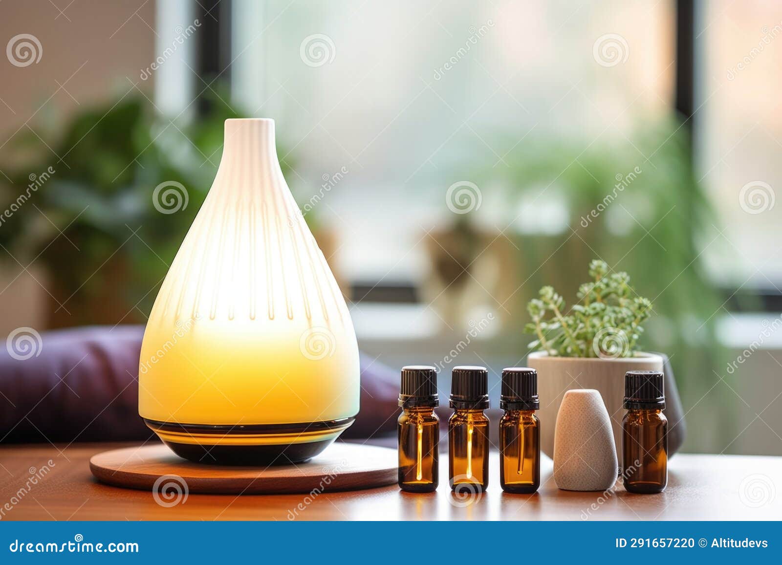 Aromatherapy Diffuser with Bottles of Medication in the Background ...