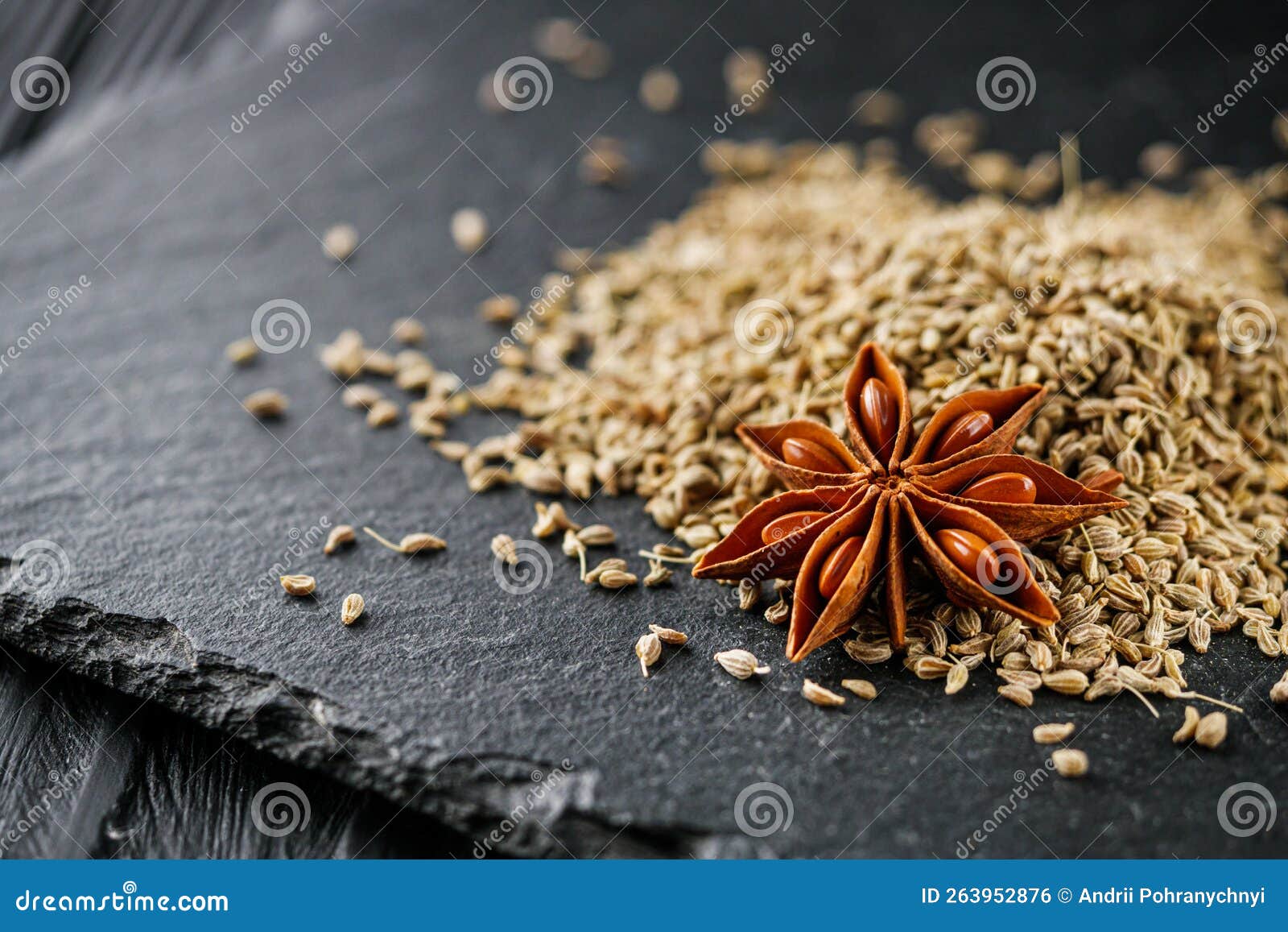 Aromatic Dry Anise Seeds on a Dark Black Stone Background Stock Photo ...