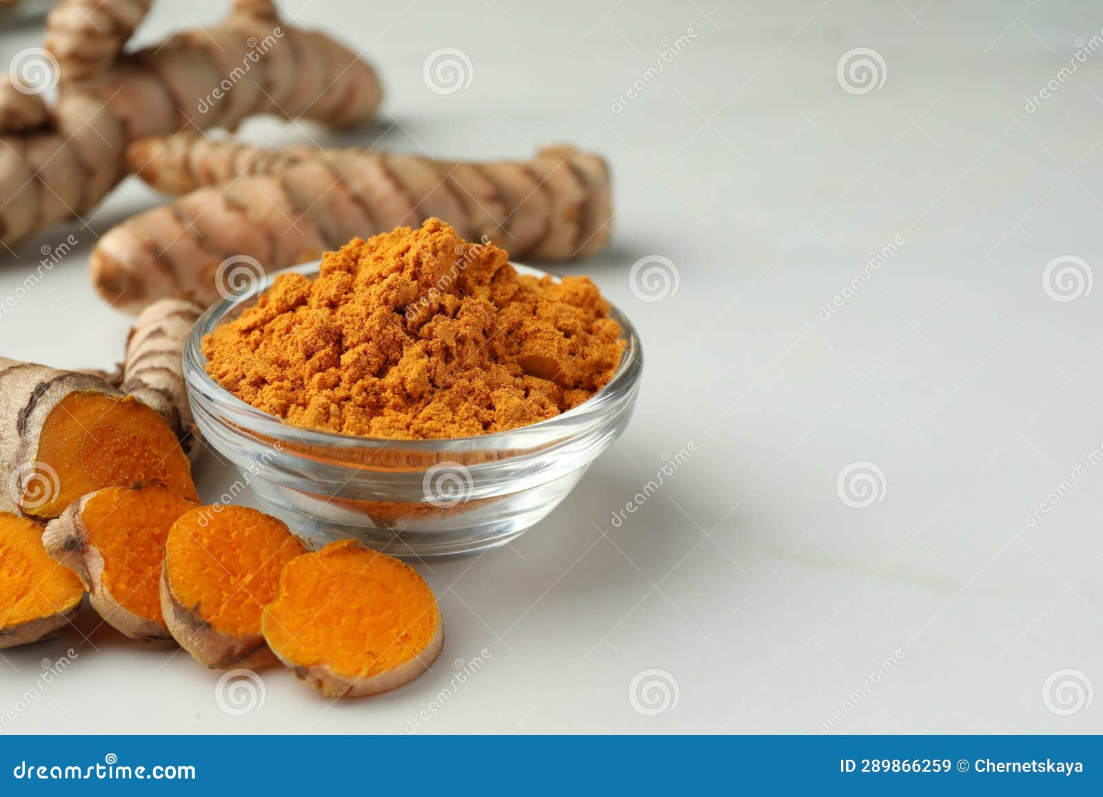 Aromatic Turmeric Powder and Raw Roots on White Table, Closeup. Space ...