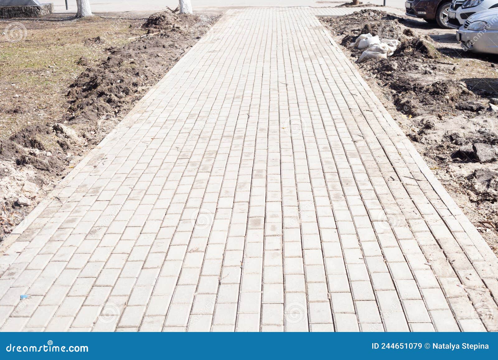 Around the Pavement Path with Tiled Slabs a Lot of Construction Debris ...