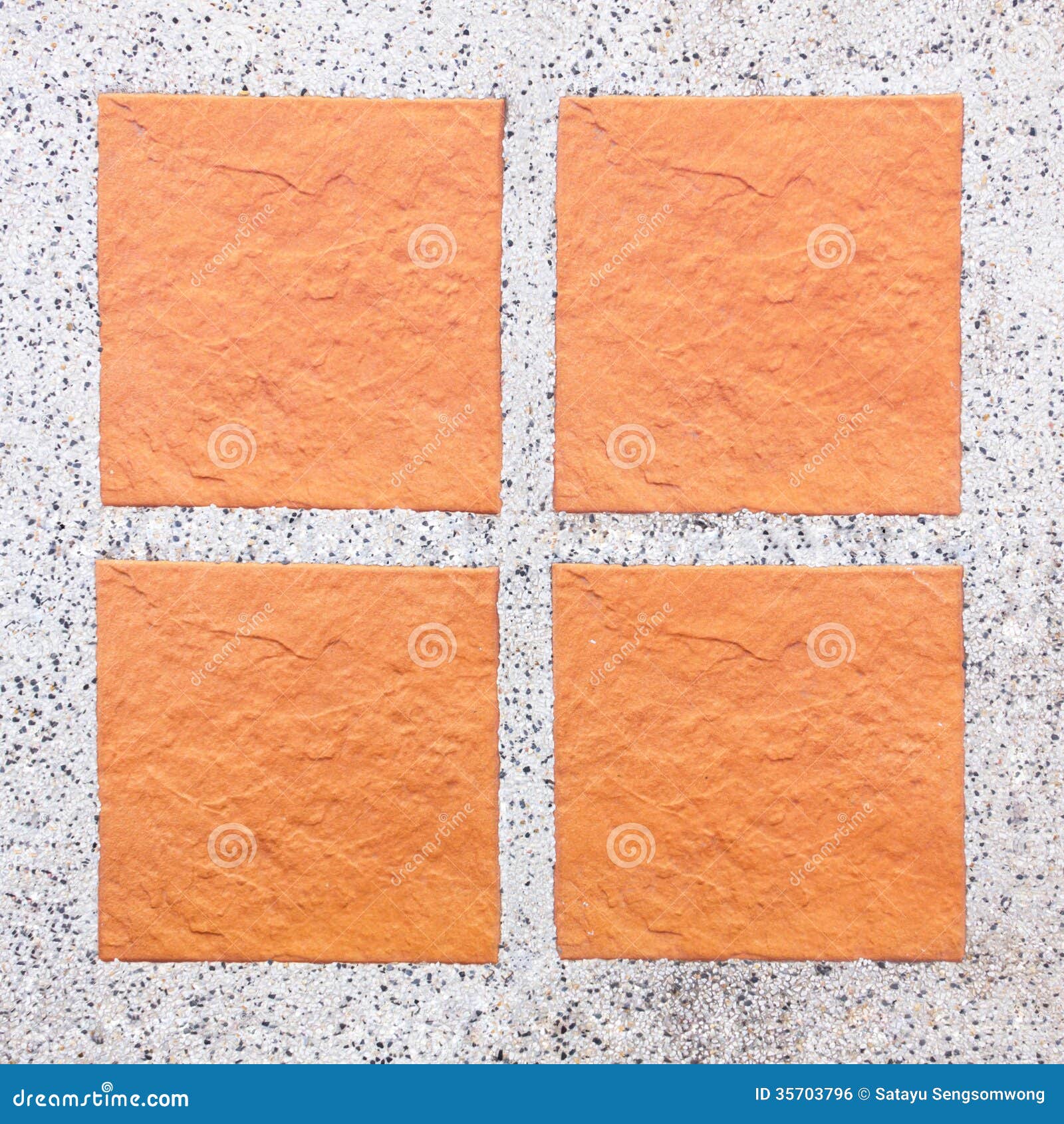 An Arrangement of Four Tiles on Pebble Background Stock Photo - Image ...