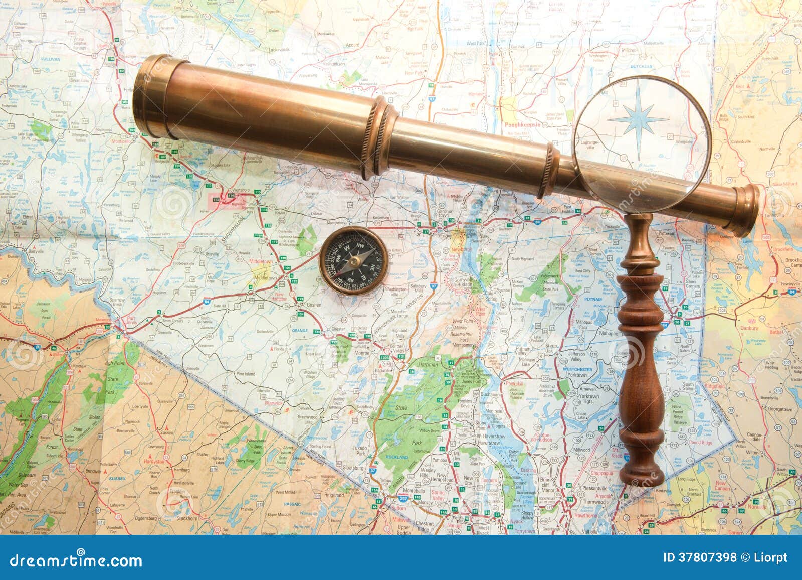 Arrangement of Map, Hand Held Telescope, Compass and Magnifying Glass ...