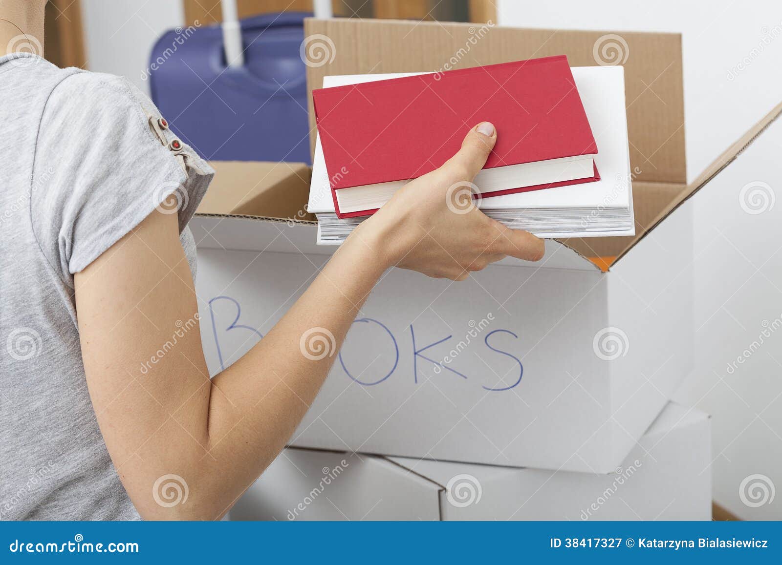 Arranging books stock image. Image of alone, carton, book - 38417327