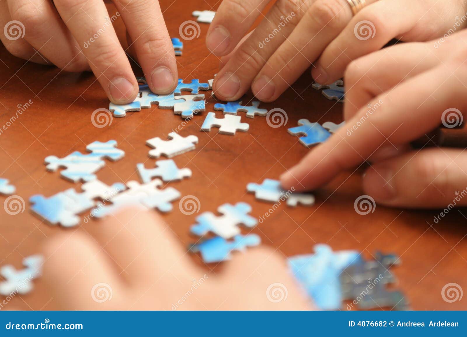 Arranging puzzle pieces stock photo. Image of business - 4076682