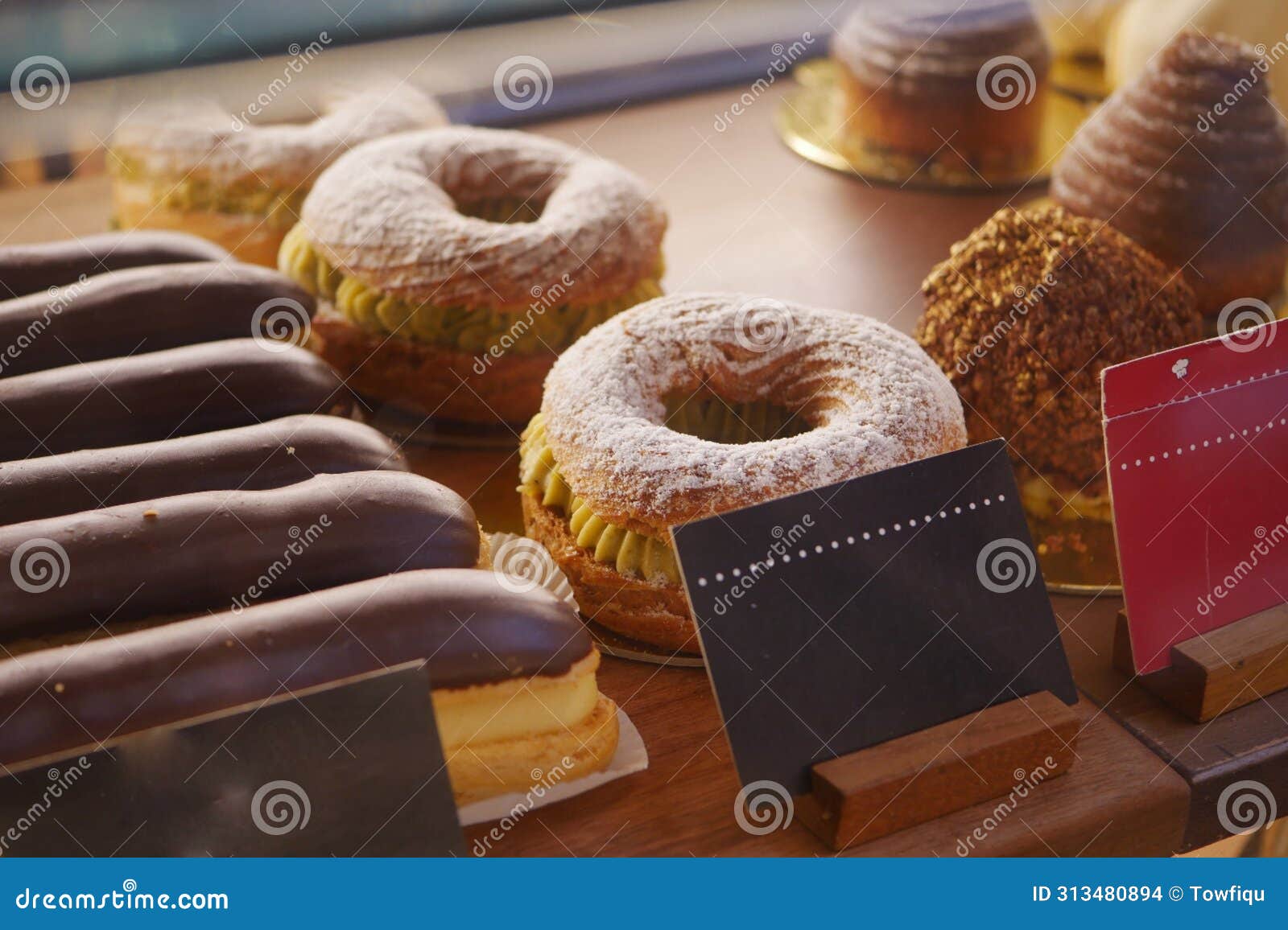 An Array of Baked Goods, Including Pastries, is Showcased in the Bakery ...