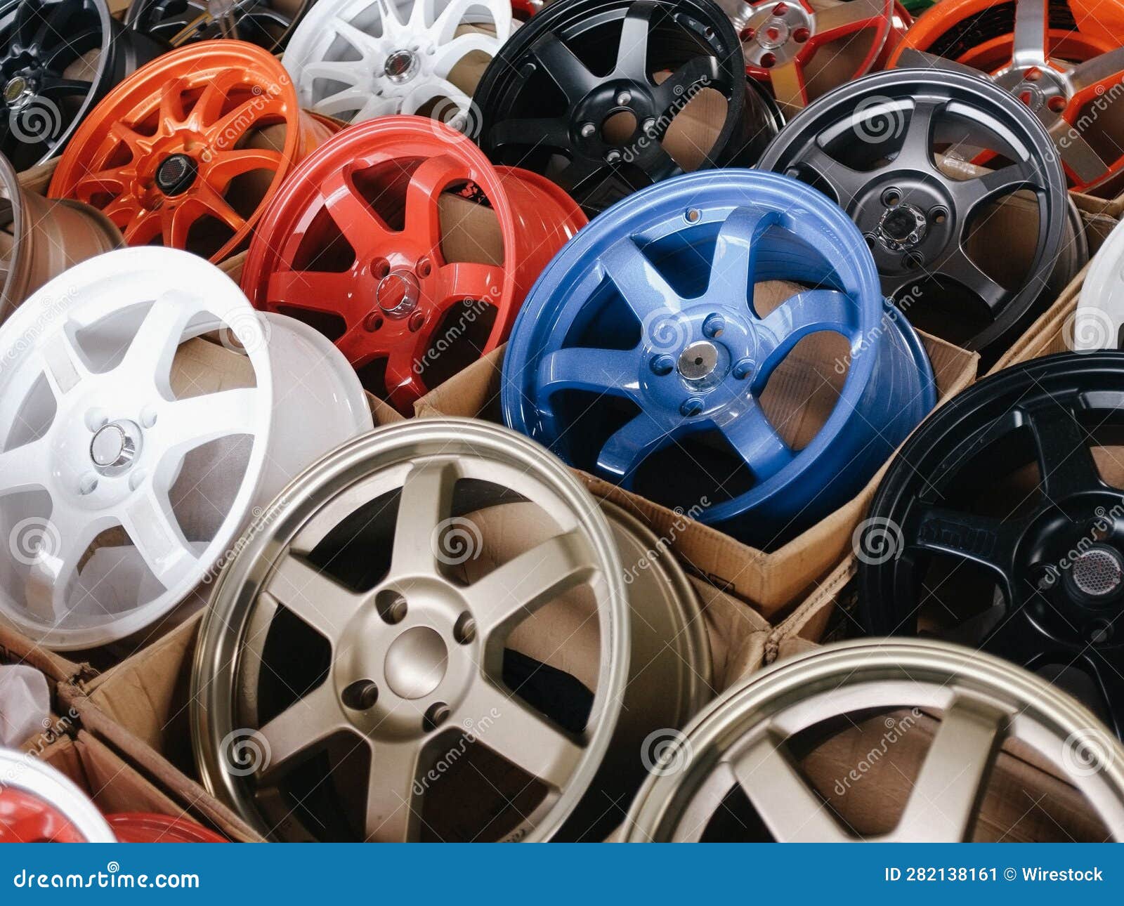 A Bunch of Rims are Lined Up with Boxes in Them Stock Image - Image of ...