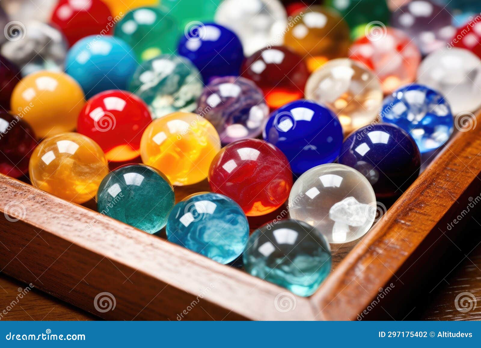 Array of Colorful Marbles Displayed on a Wooden Tray Stock Photo ...