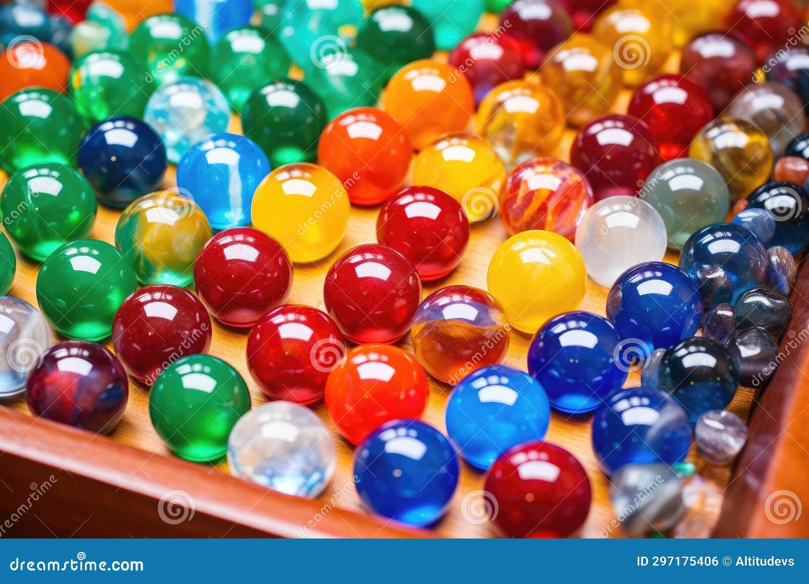 Array of Colorful Marbles Displayed on a Wooden Tray Stock Photo ...