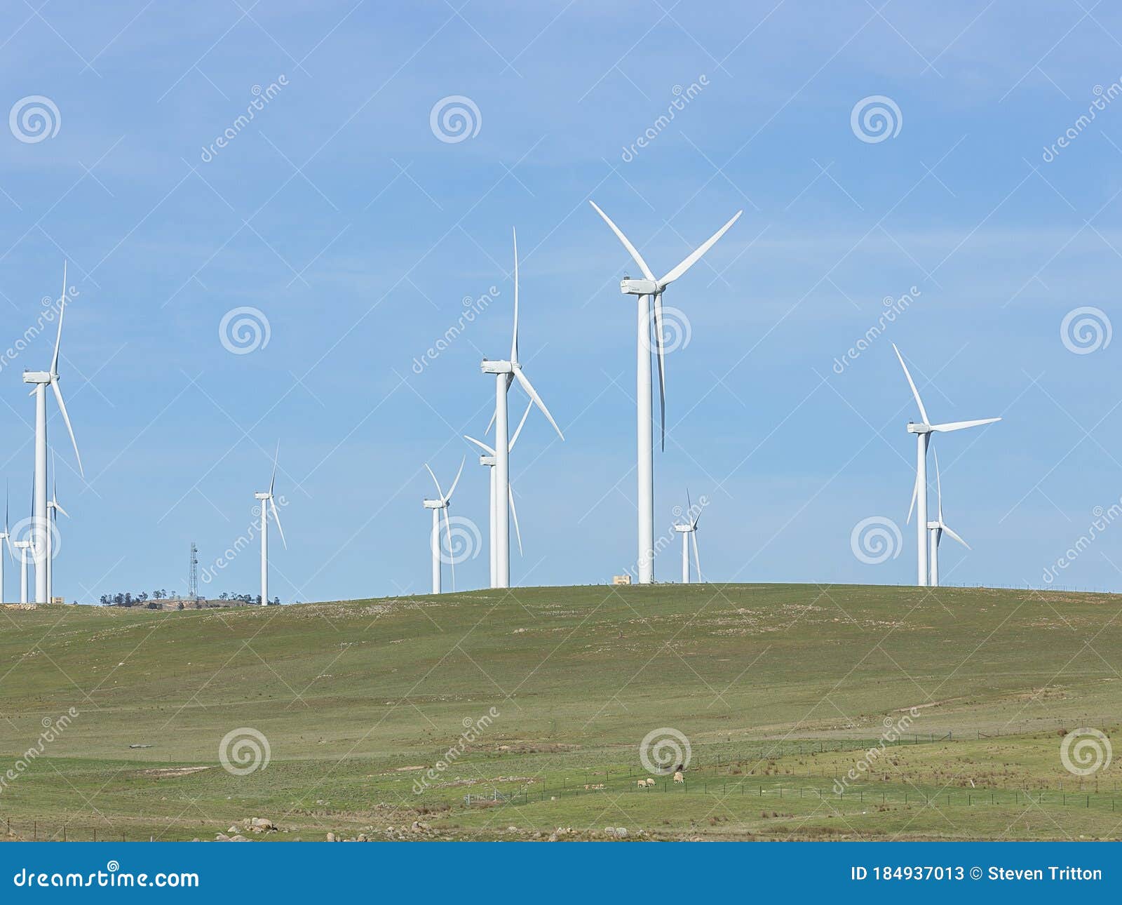 An Array of Large Wind Turbines Moving To Create Kinetic Energy for ... An Array of Large Wind Turbines Moving To Create Kinetic Energy for ...