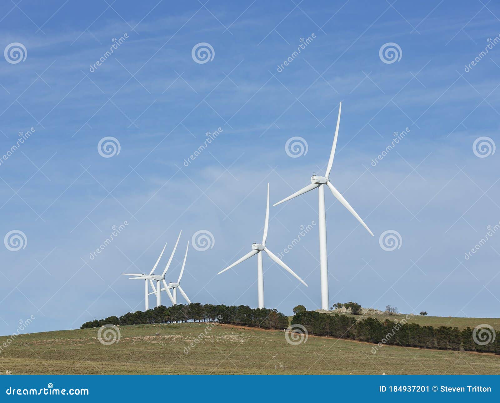 An Array of Large Wind Turbines Moving To Create Kinetic Energy for ... An Array of Large Wind Turbines Moving To Create Kinetic Energy for ...