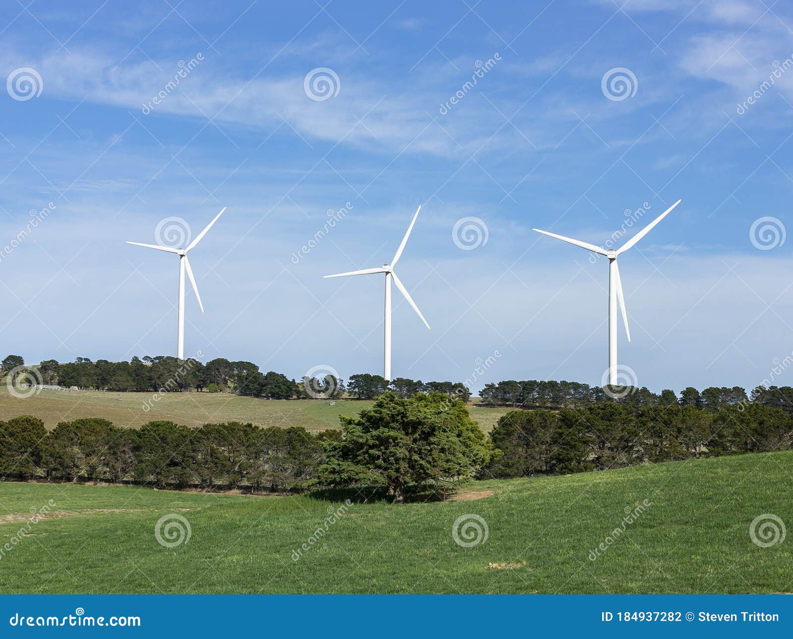 An Array of Large Wind Turbines Moving To Create Kinetic Energy for ... An Array of Large Wind Turbines Moving To Create Kinetic Energy for ...