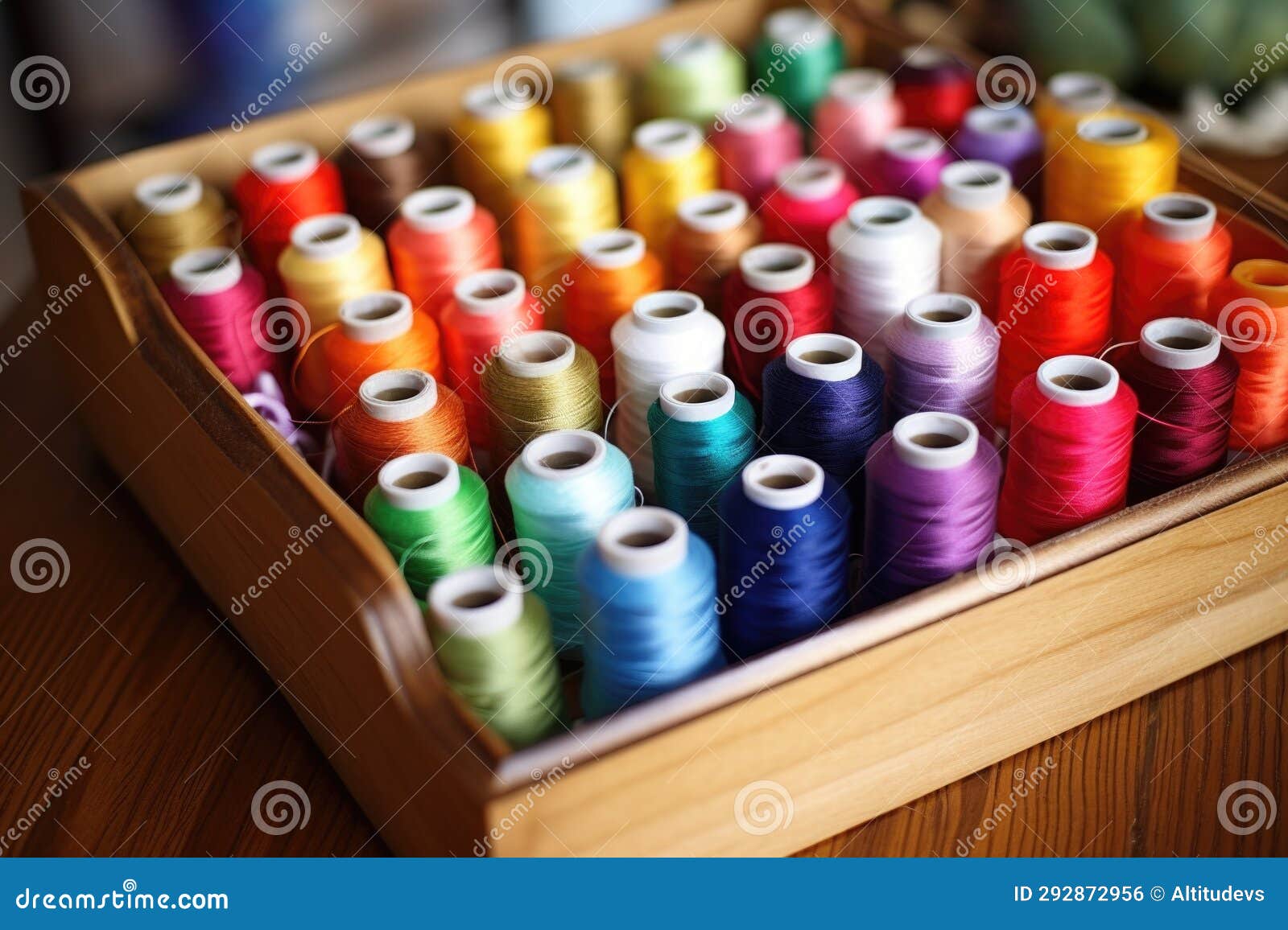 Array of Multi-colored Thread Spools in a Sewing Box Stock Photo ...