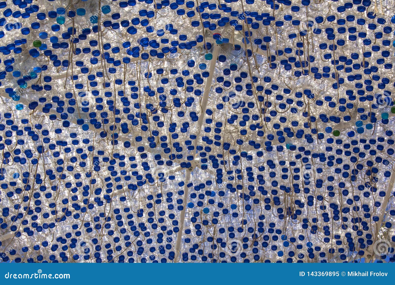 Array of Plastic Bottles Hanging Lid Down. Ecological Collection of ...