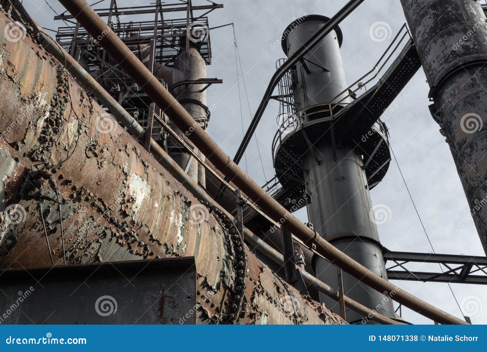 Array of Riveted Pipes and Smokestacks, Catwalks and Ladders of ...