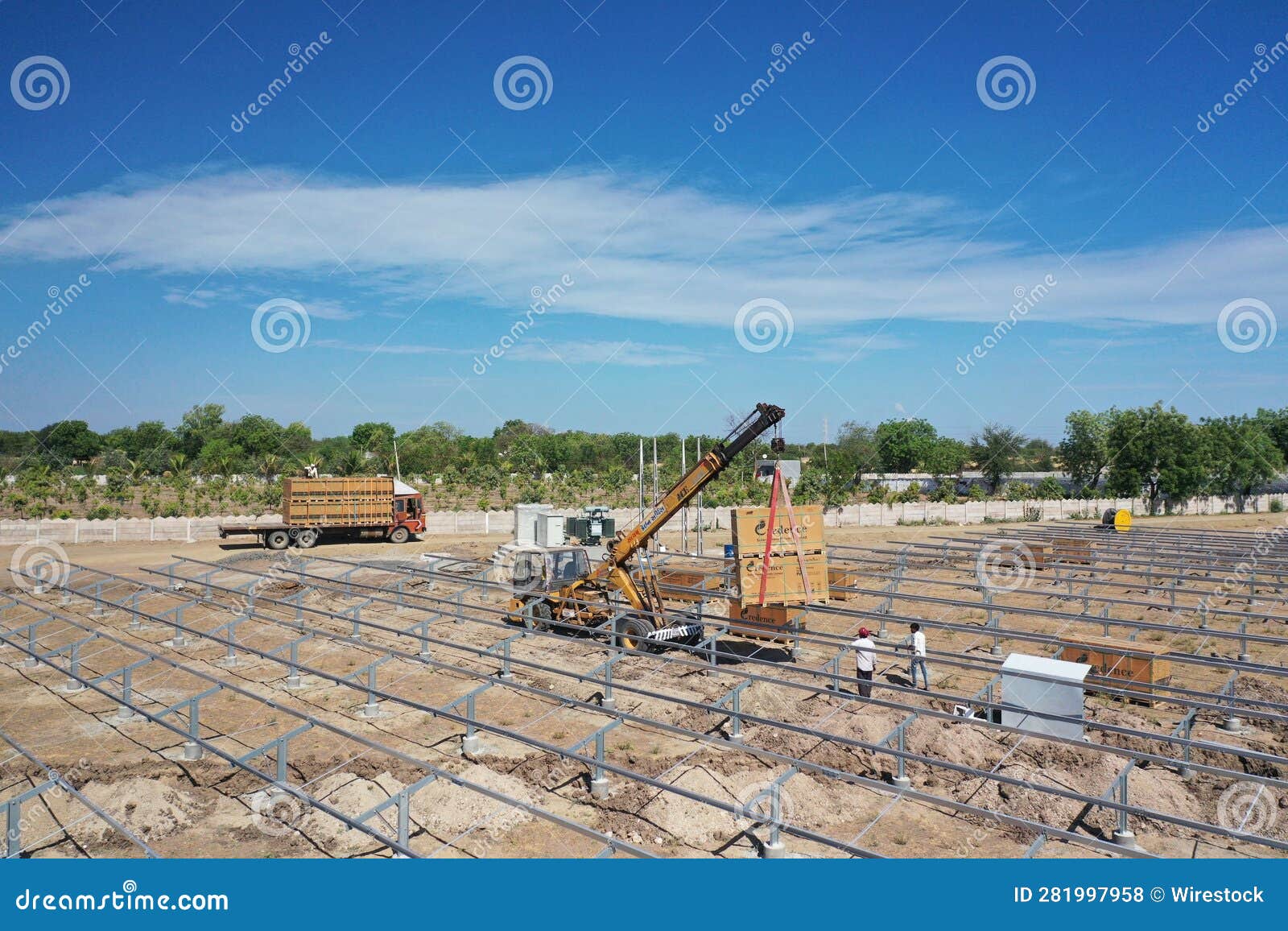 Array of Solar Panels Installed in a Rural Field, with Electrical ...