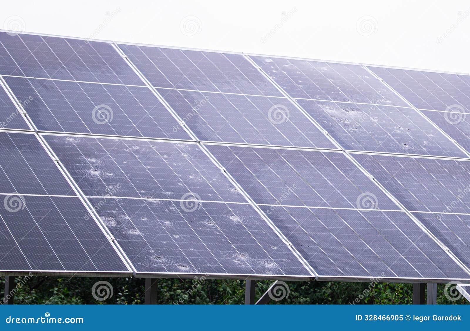 Array of Solar Panels with Visible Hail Damage and Water Spots ...