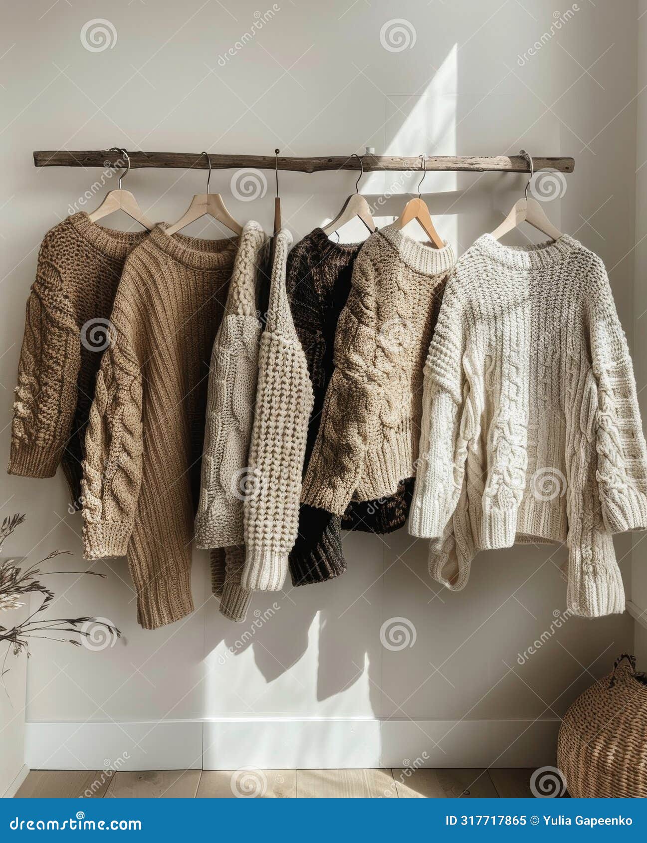 Array of Sweaters Hanging on Rack in Room Stock Image - Image of ...