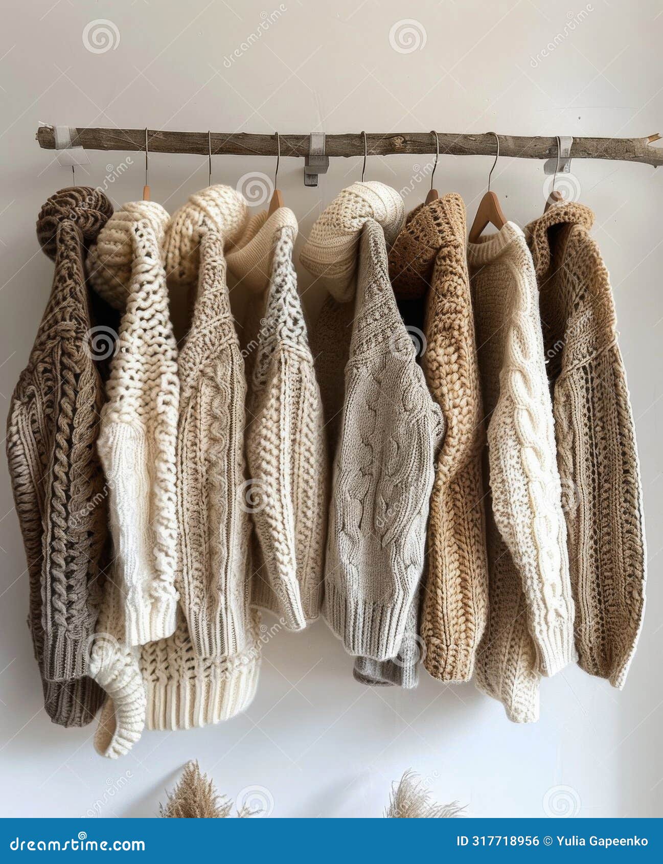 Array of Sweaters Hanging on Rack in Room Stock Photo - Image of ...