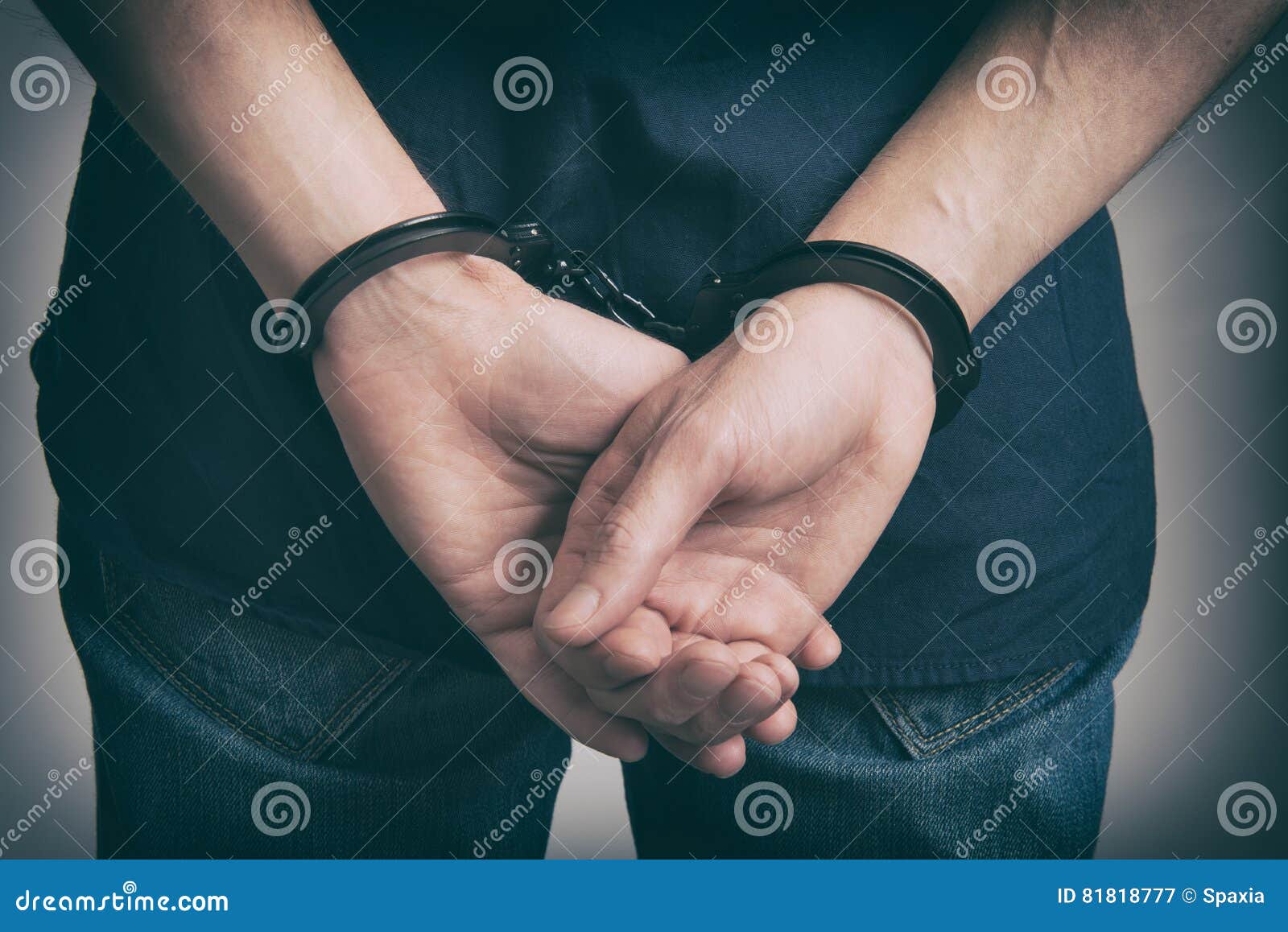Arrested Man in Handcuffs with Hands Behind Back Stock Image - Image of ...