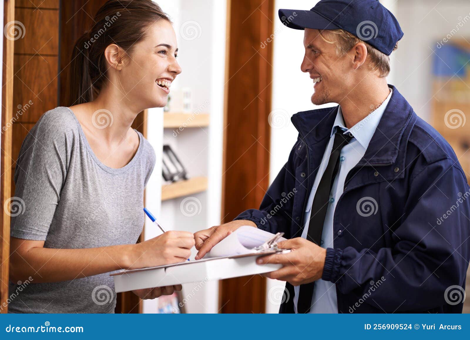 It always Arrives on Time. a Courier Making a Delivery To a Smiling ...
