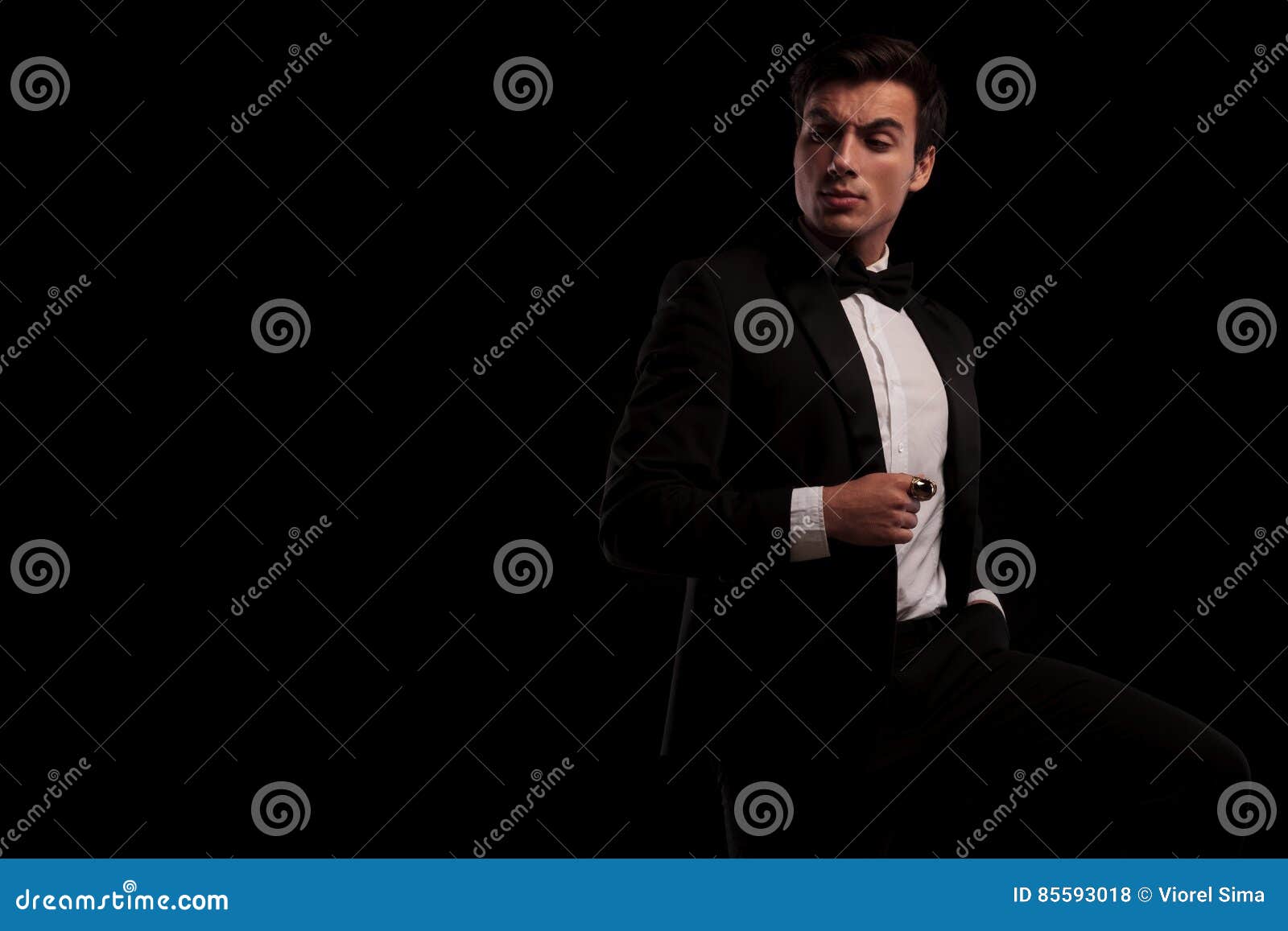 Arrogant Young Man in Tuxedo and Bowtie Looking Back Stock Photo ...