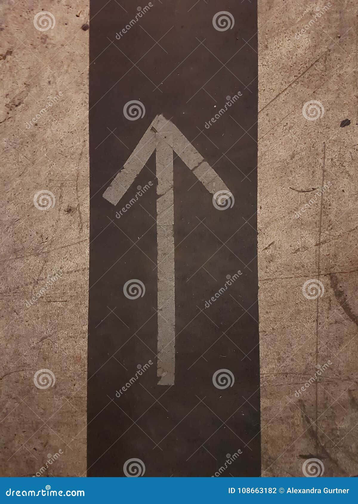 Arrow on concrete floor stock photo. Image of arrow - 108663182