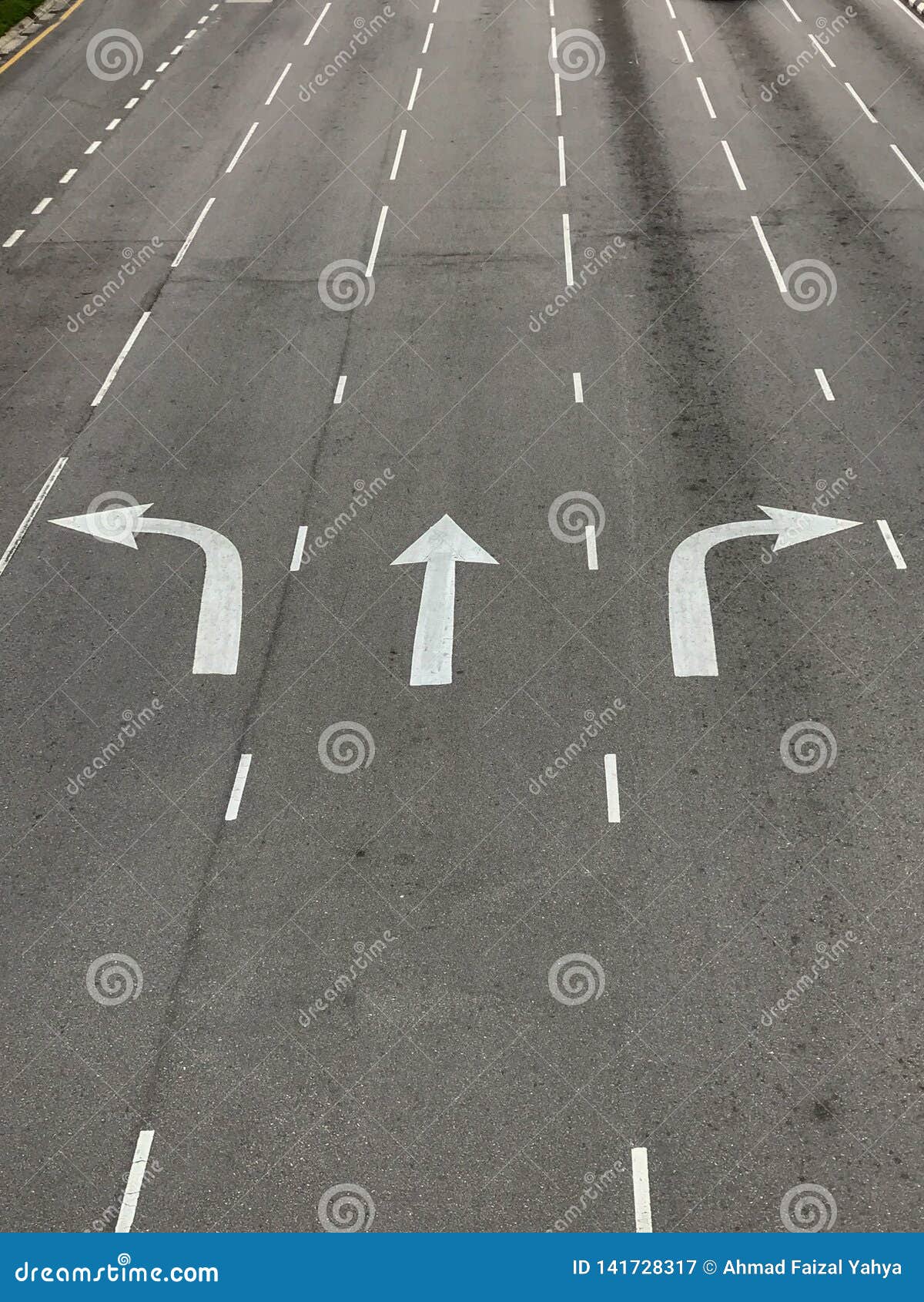 Arrow Directions on Asphalt Road at a Junction Stock Image - Image of ...