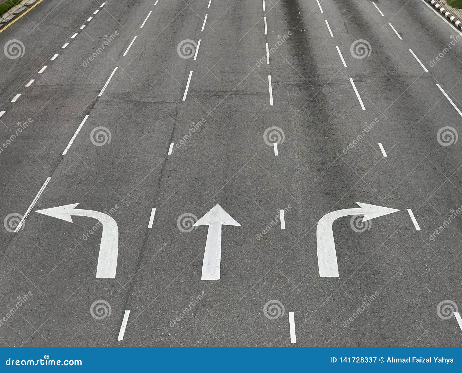 Arrow Directions on Asphalt Road at a Junction Stock Image - Image of ...