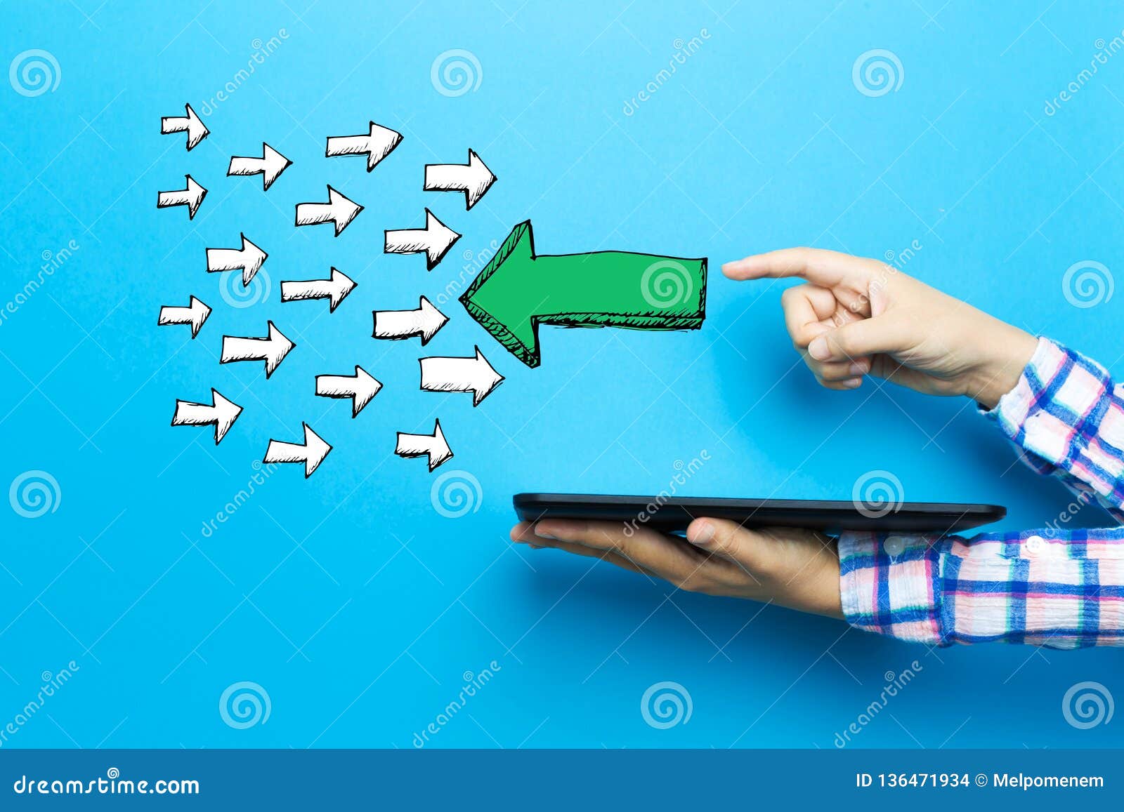 Arrow Facing In A Opposite Direction With A Tablet Computer Stock Photo ...