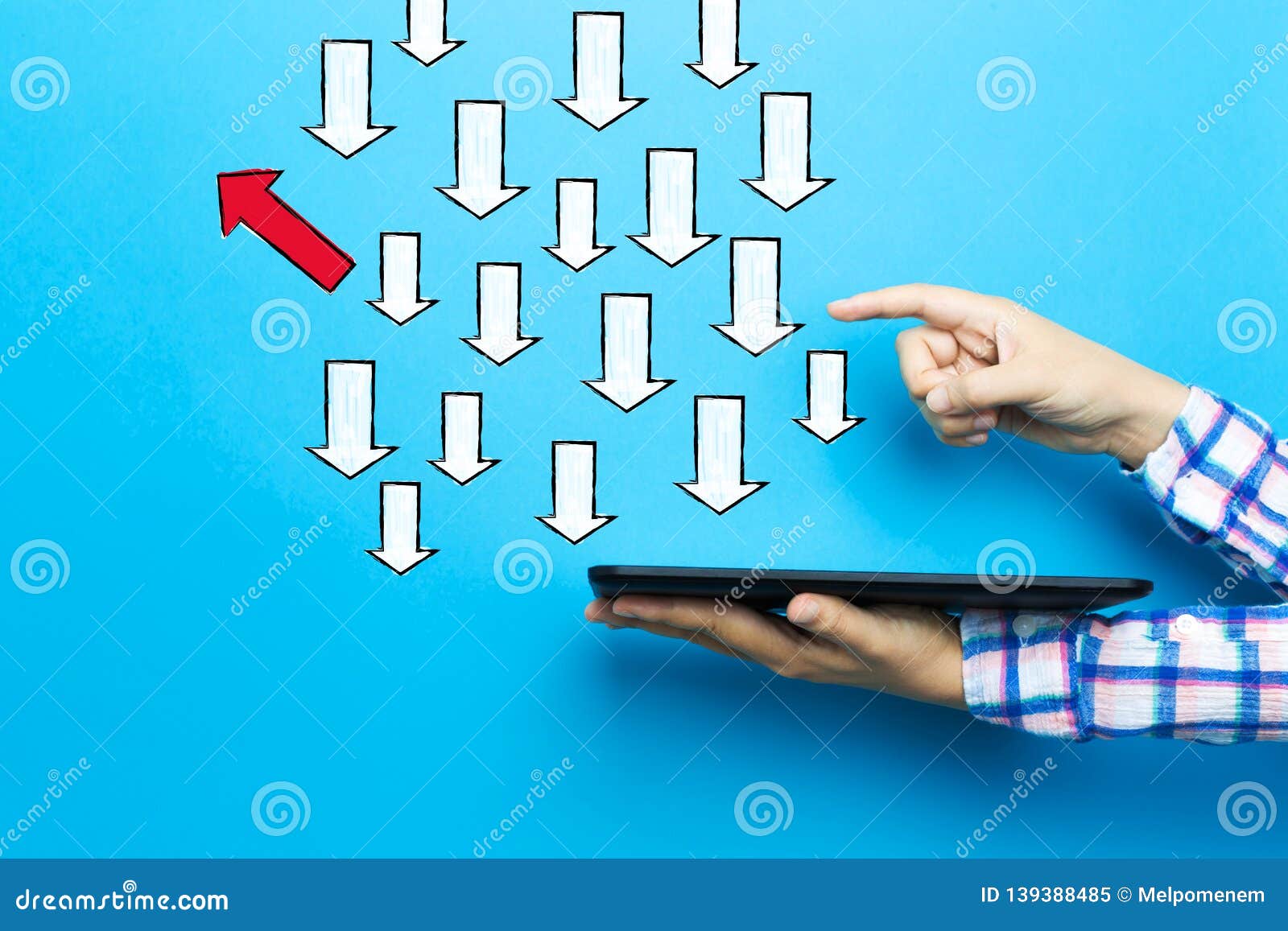 Arrow Going in a Different Direction with a Tablet Computer Stock Image ...