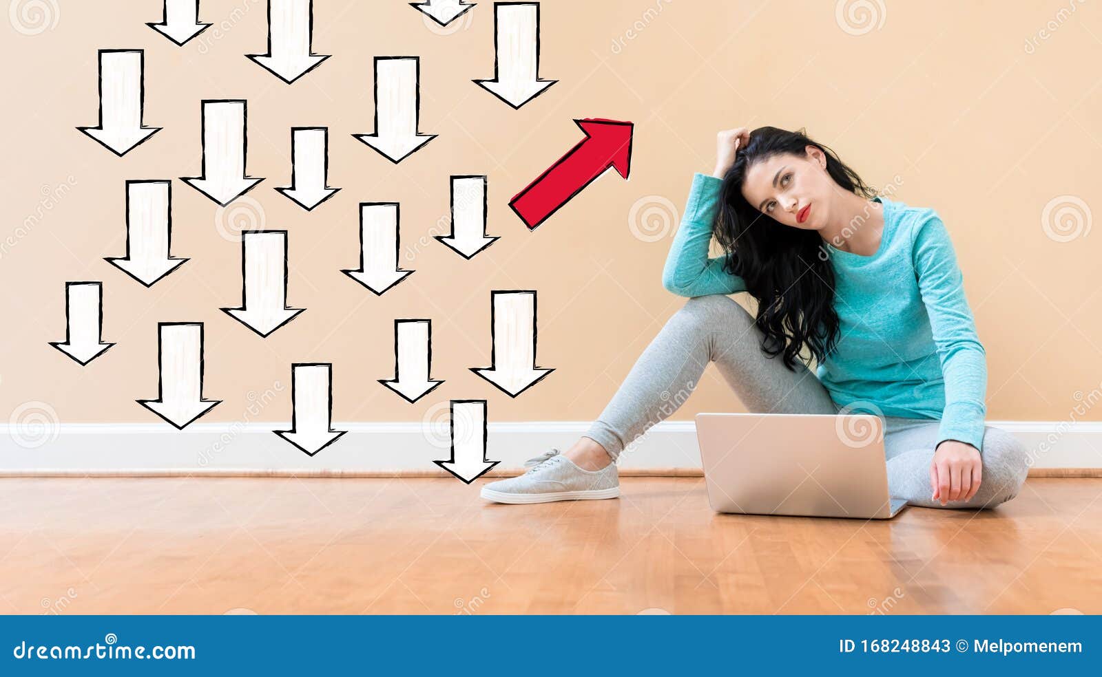 Arrow Going in a Different Direction with Woman Using a Laptop Stock ...