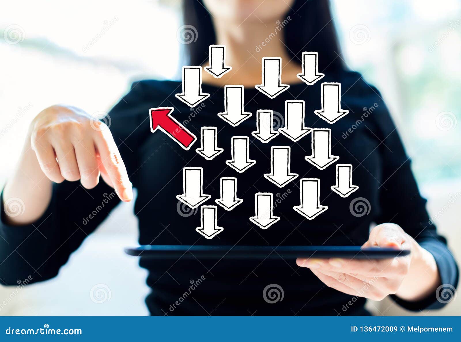 Arrow Going in a Different Direction with Woman Using Tablet Stock ...