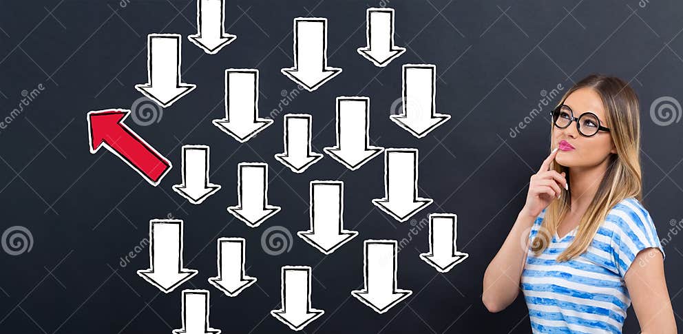 Arrow Going in a Different Direction with Young Woman Stock Image ...