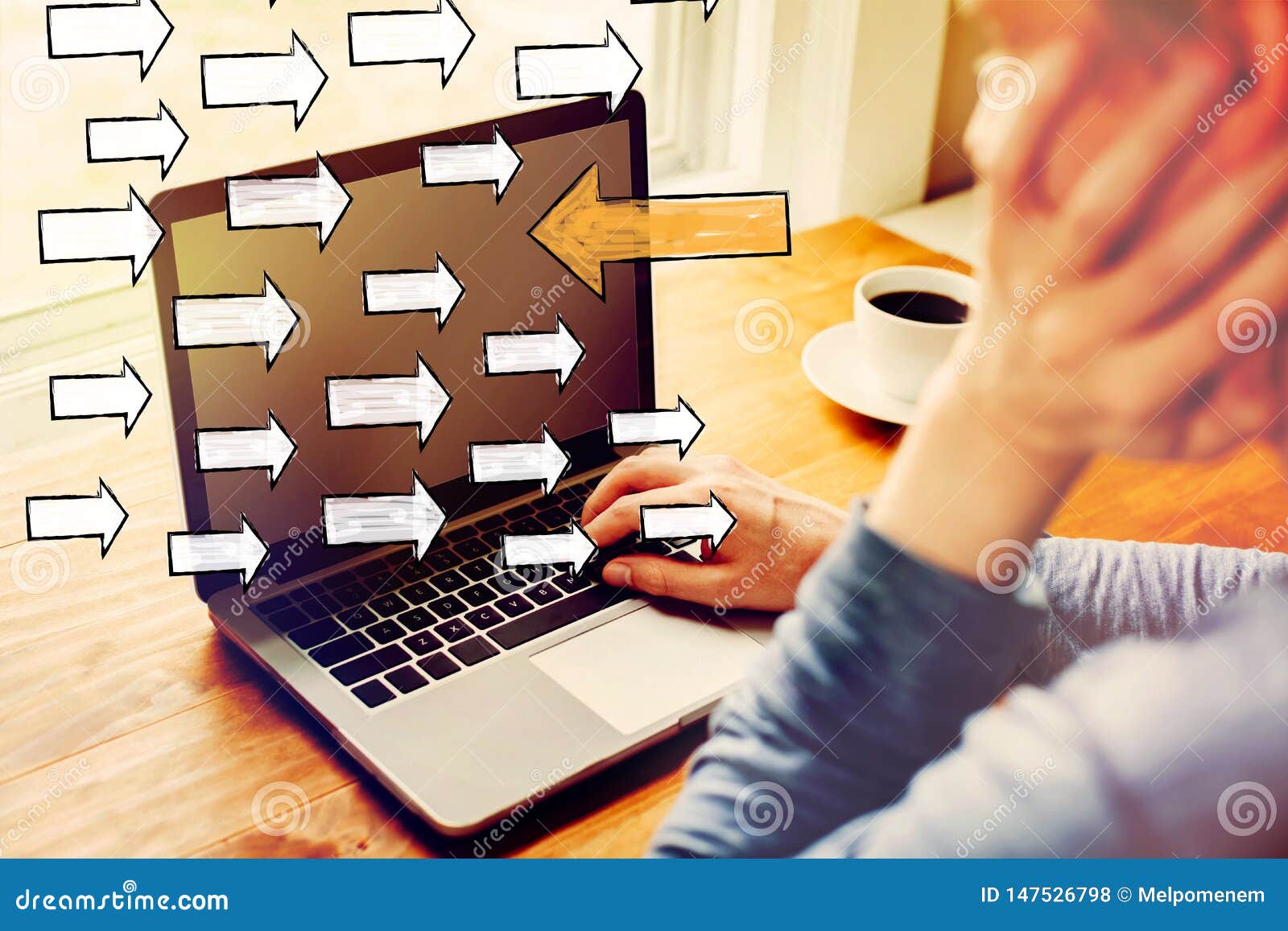 Arrow Going in the Opposite Direction with Man Using a Laptop Stock ...