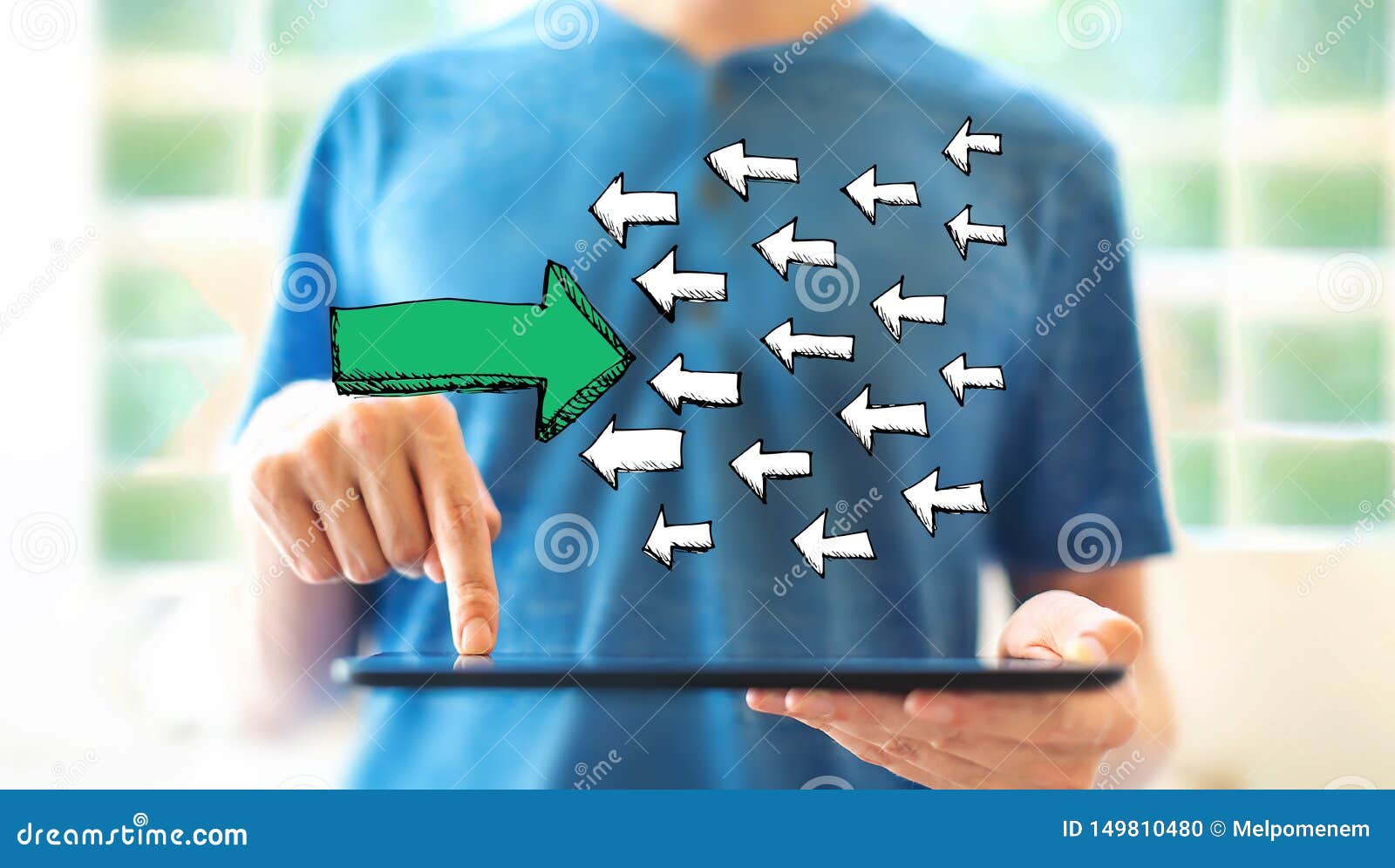 Arrow Going in the Opposite Direction with Man Using a Tablet Stock ...