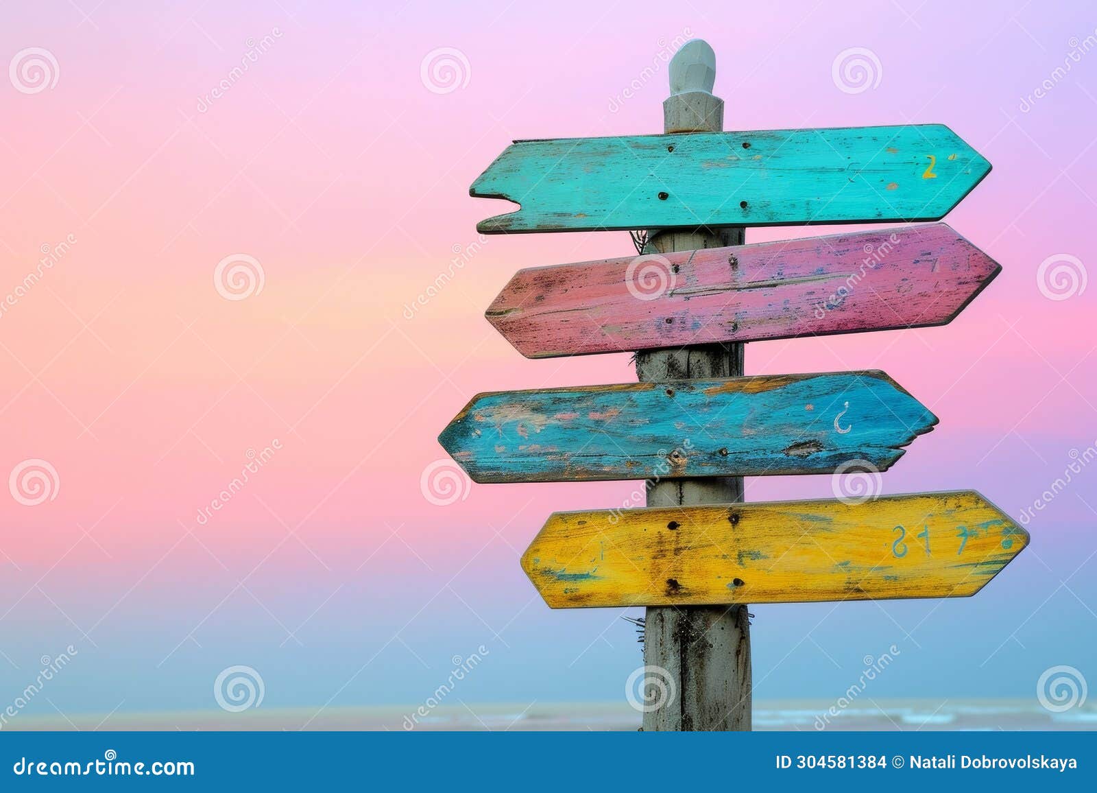 An Arrow on a Post Pointing To Different Destinations Stock Photo ...