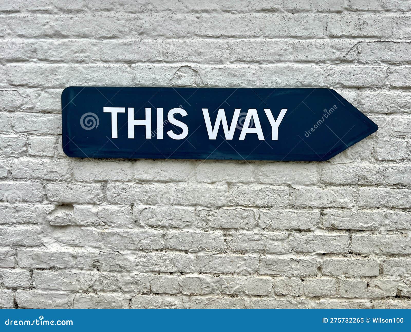 This Way Sign stock image. Image of letters, arrow, wall - 275732265