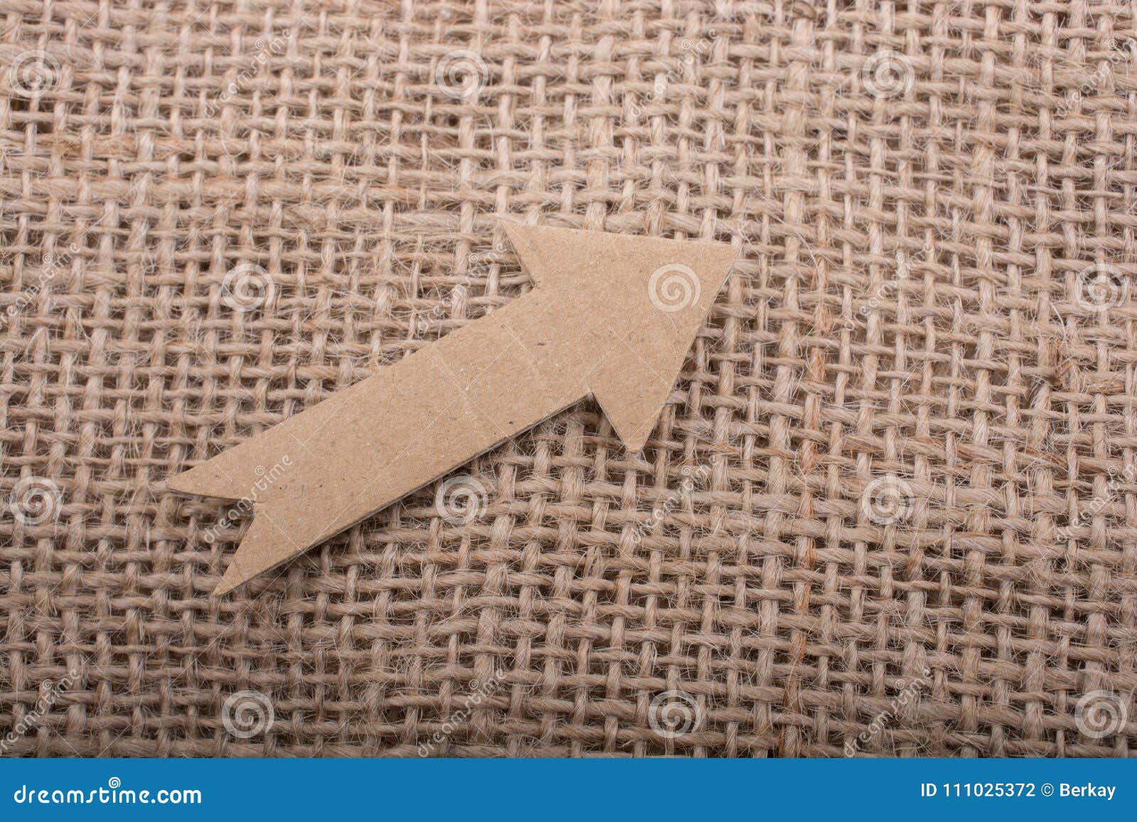 Arrow Cut Out of Brown Paper Stock Photo - Image of choice, success ...