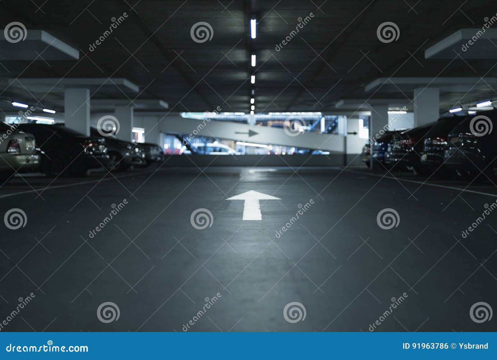 Arrow Sign on Driving Lane in Parking Garage. Stock Photo - Image of ...